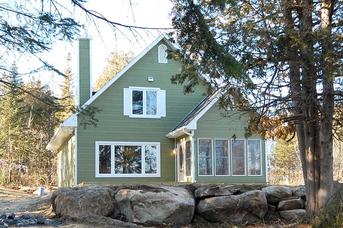 Plan 21478DR: Nature-Embracing Chalet