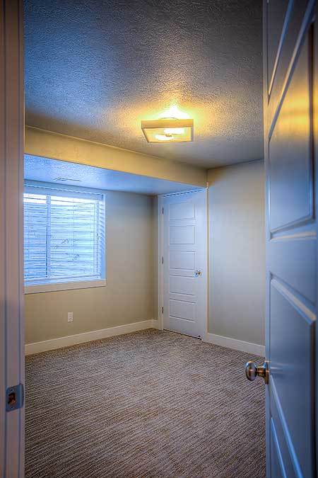 Expandable House Plan with Alley-Entry Garage and Deck over Entry ...